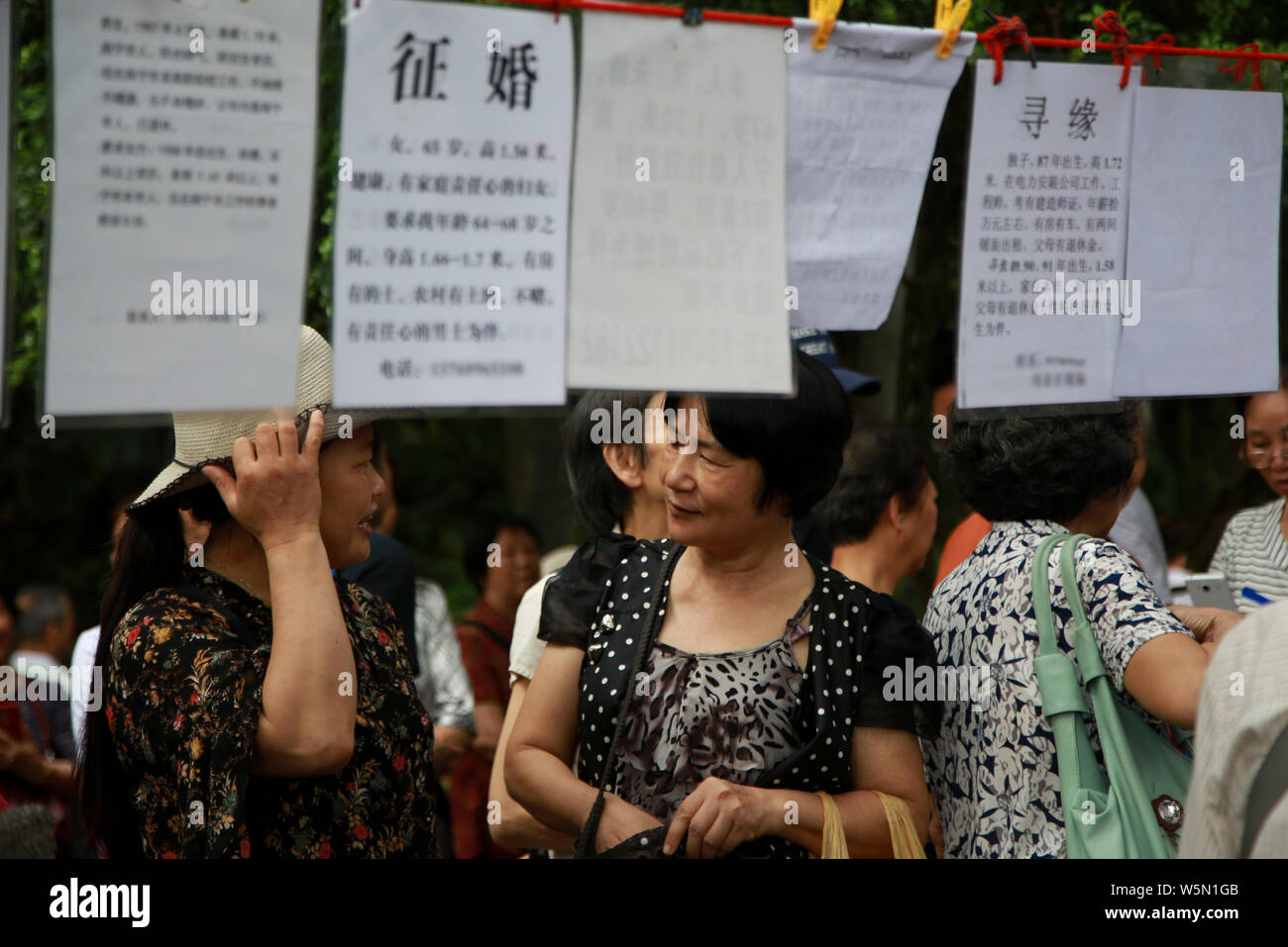 Chinese parents and visitors read profiles of singletons to look for ...