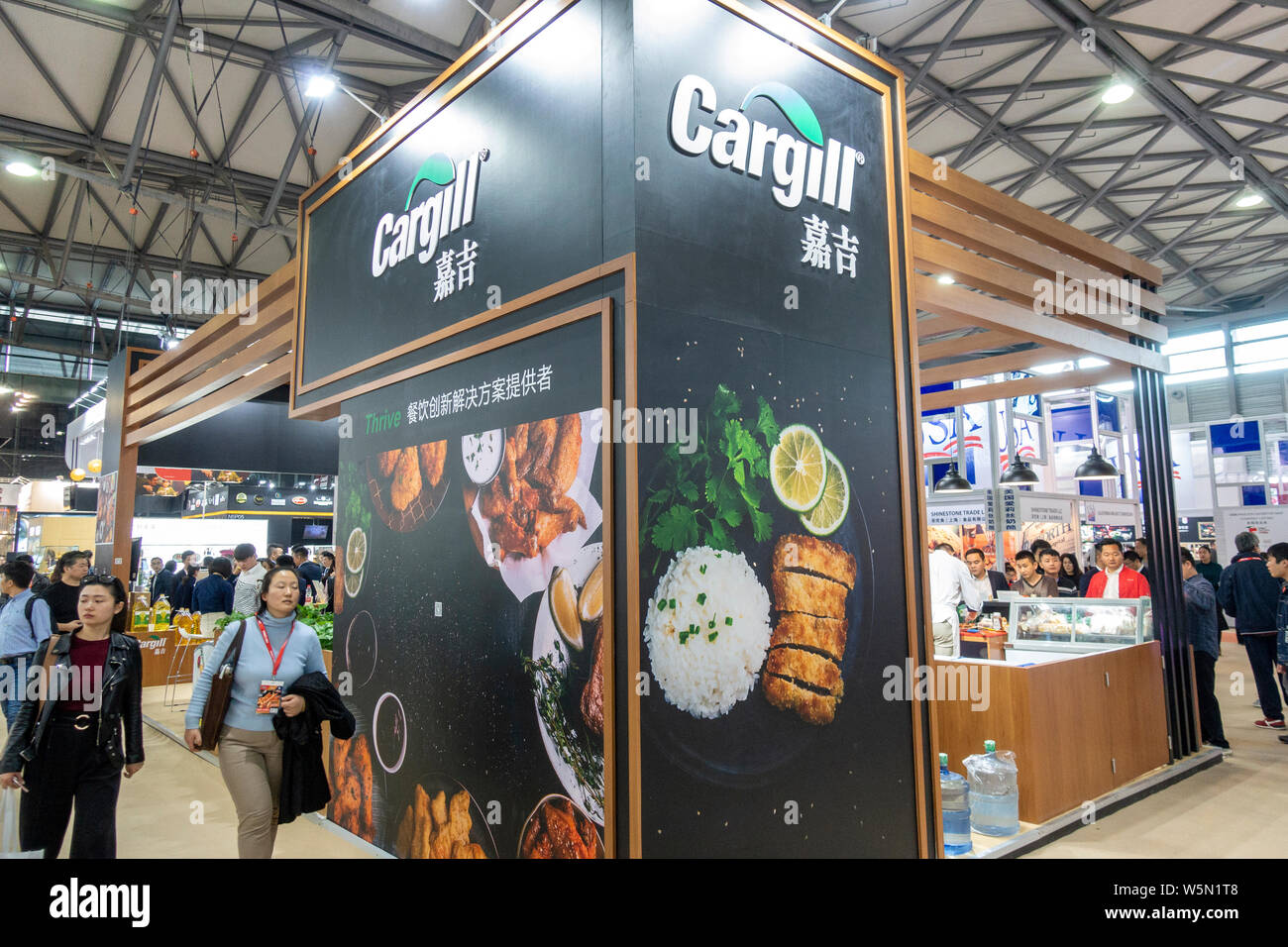 --FILE--People visit the stand of Cargill during the 22nd Food & Hotel ...
