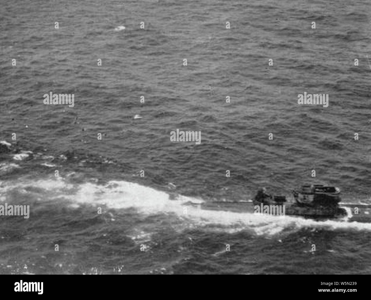 Damaged German submarine U-505 under fire in the Atlantic Ocean on 4 ...