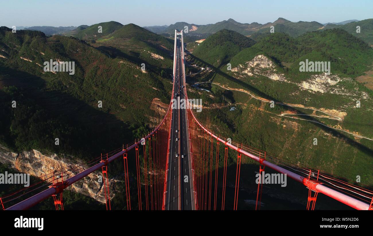 Cars drive on the Qingshui River Bridge, which is third highest ...