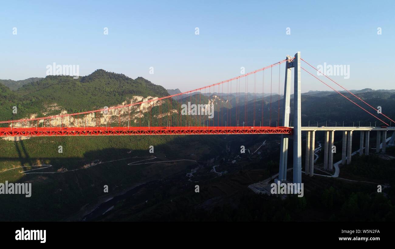 Cars drive on the Qingshui River Bridge, which is third highest ...