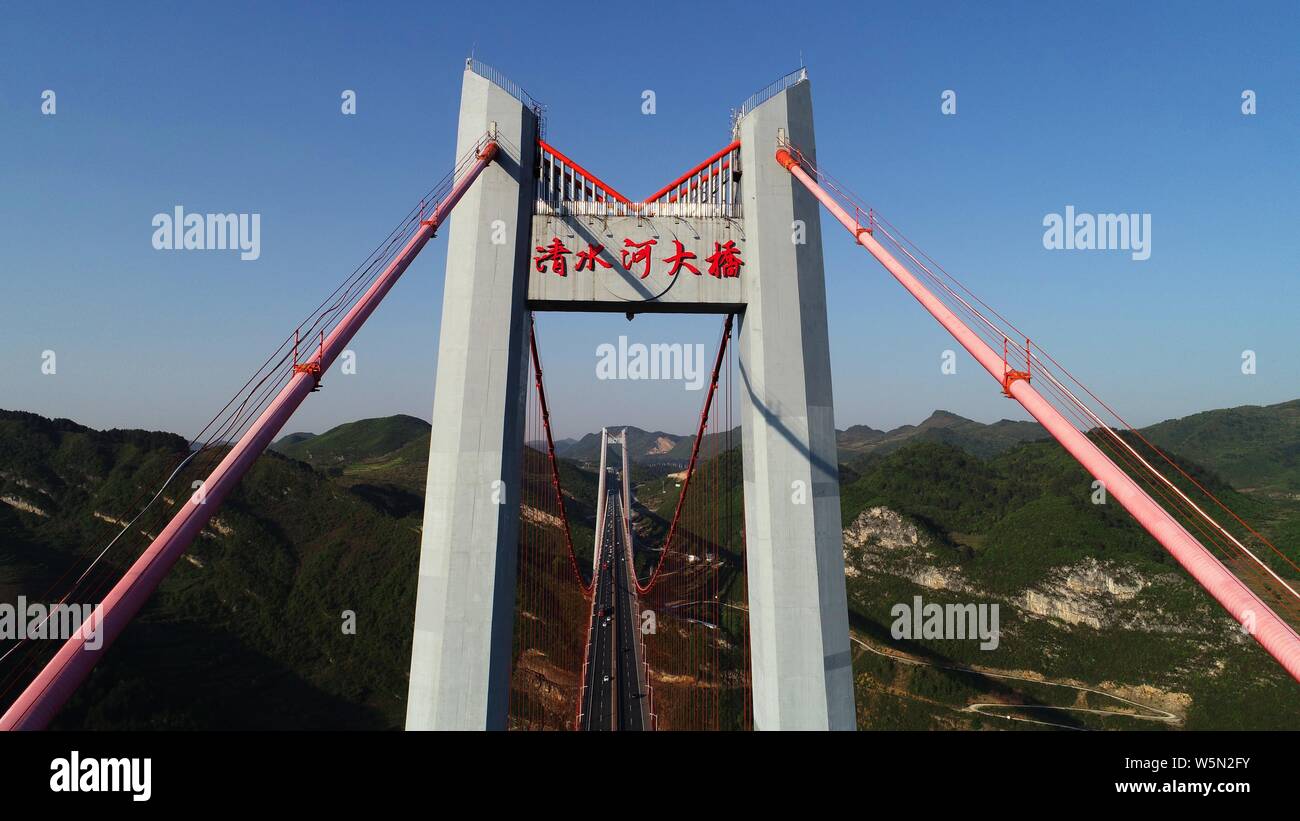 Cars drive on the Qingshui River Bridge, which is third highest ...