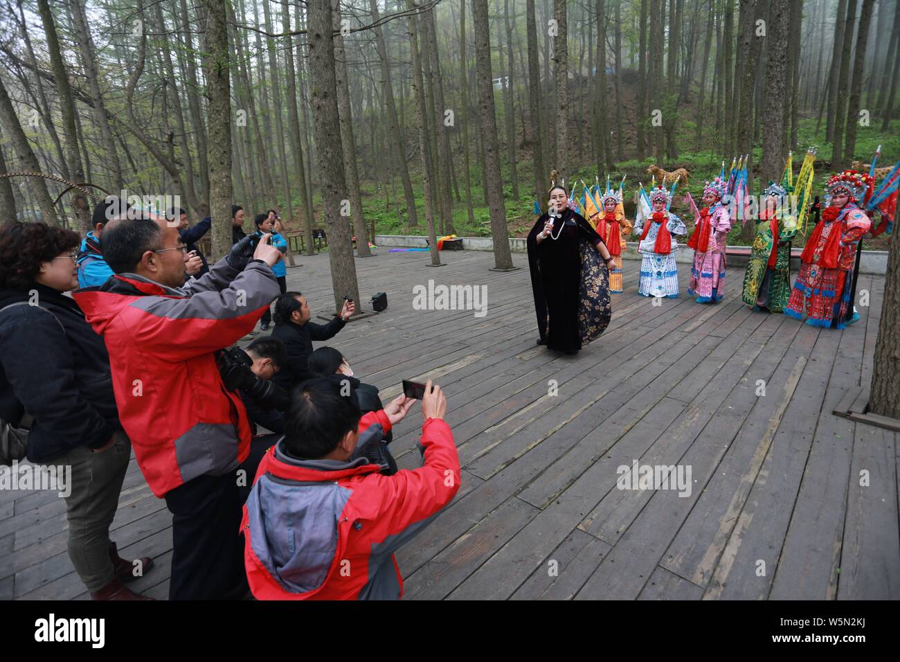 Chinese Yu Opera artists dressed in traditional costumes perform during ...