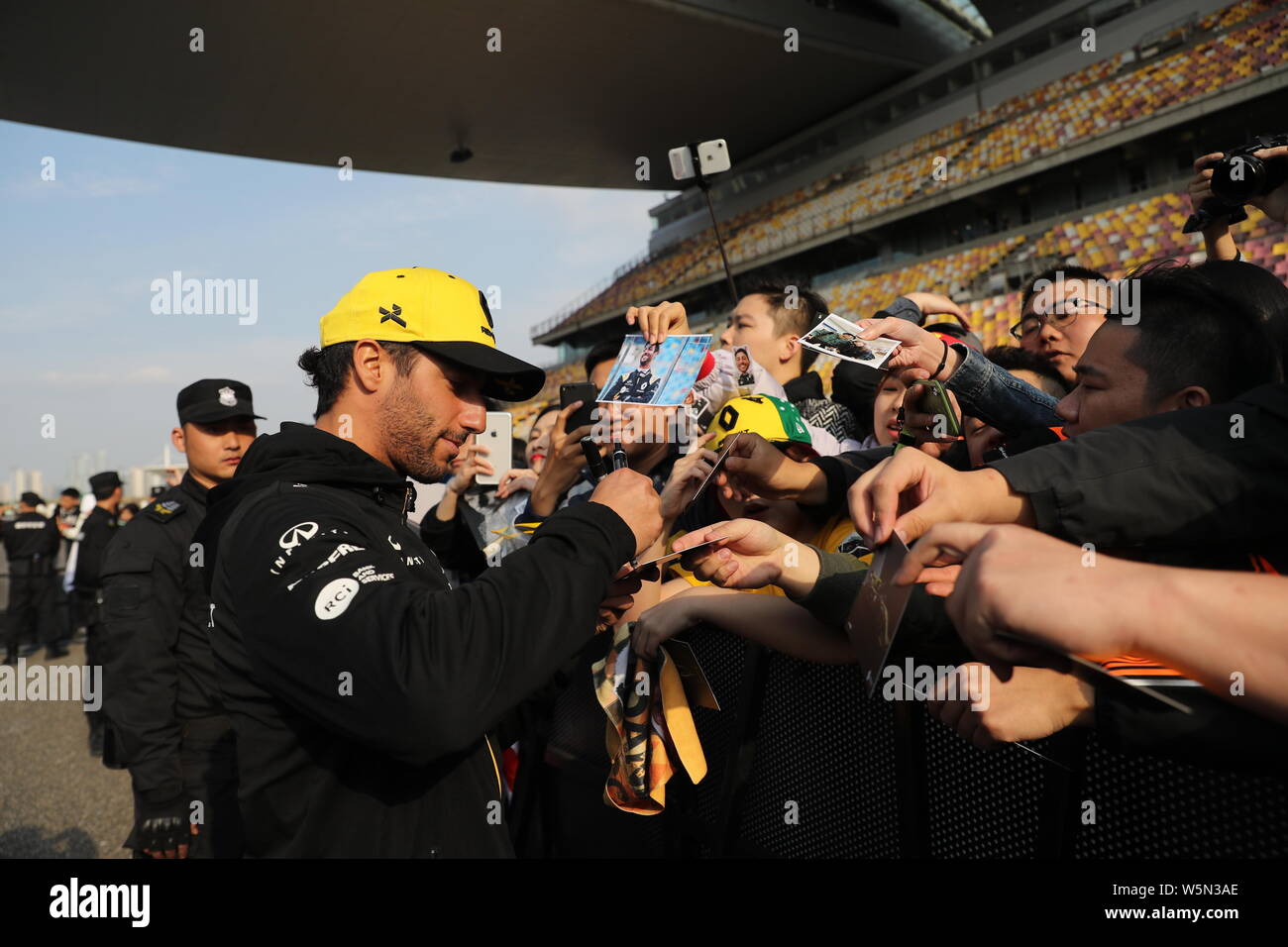 Australian racing driver Daniel Ricciardo of Renault F1 Team signs ...