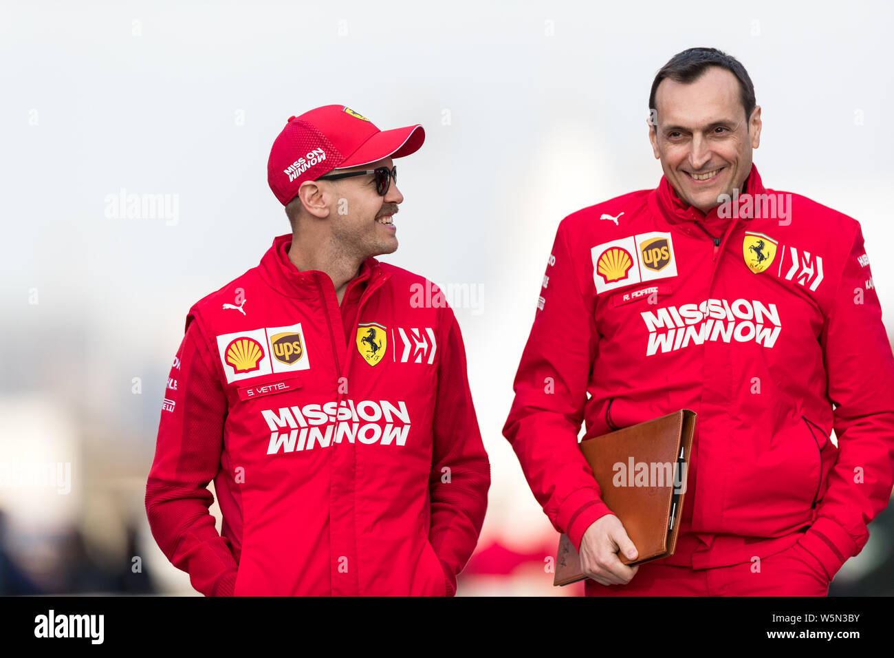 German racing driver Sebastian Vette, left, of Scuderia Ferrari is ...