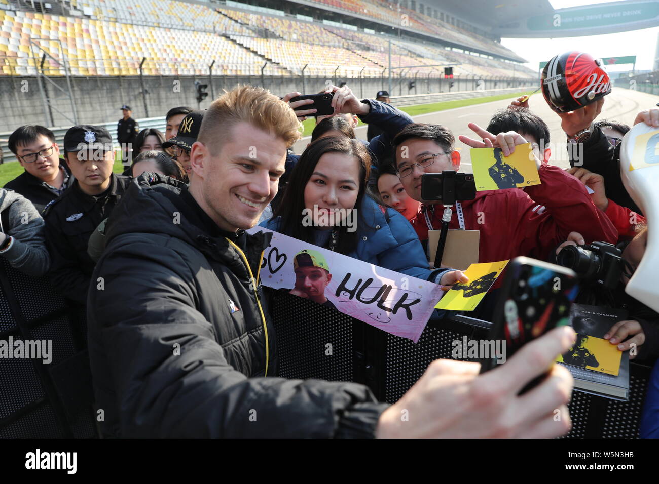 German racing driver Nico Hulkenberg of Renault F1 Team takes selfies ...