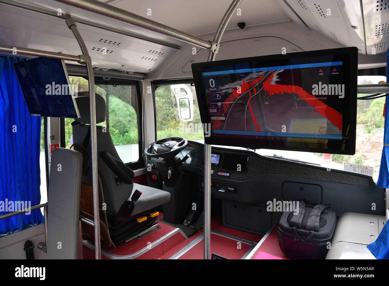 An unmanned bus drives on the world's longest and highest glass ...
