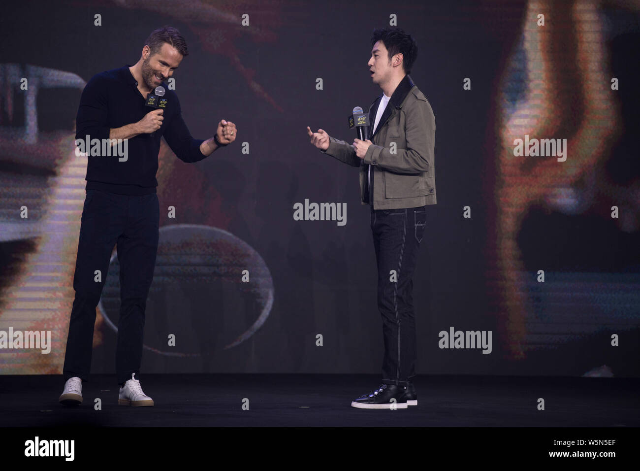 Canadian-American actor Ryan Reynolds, left, and Chinese actor Lei ...
