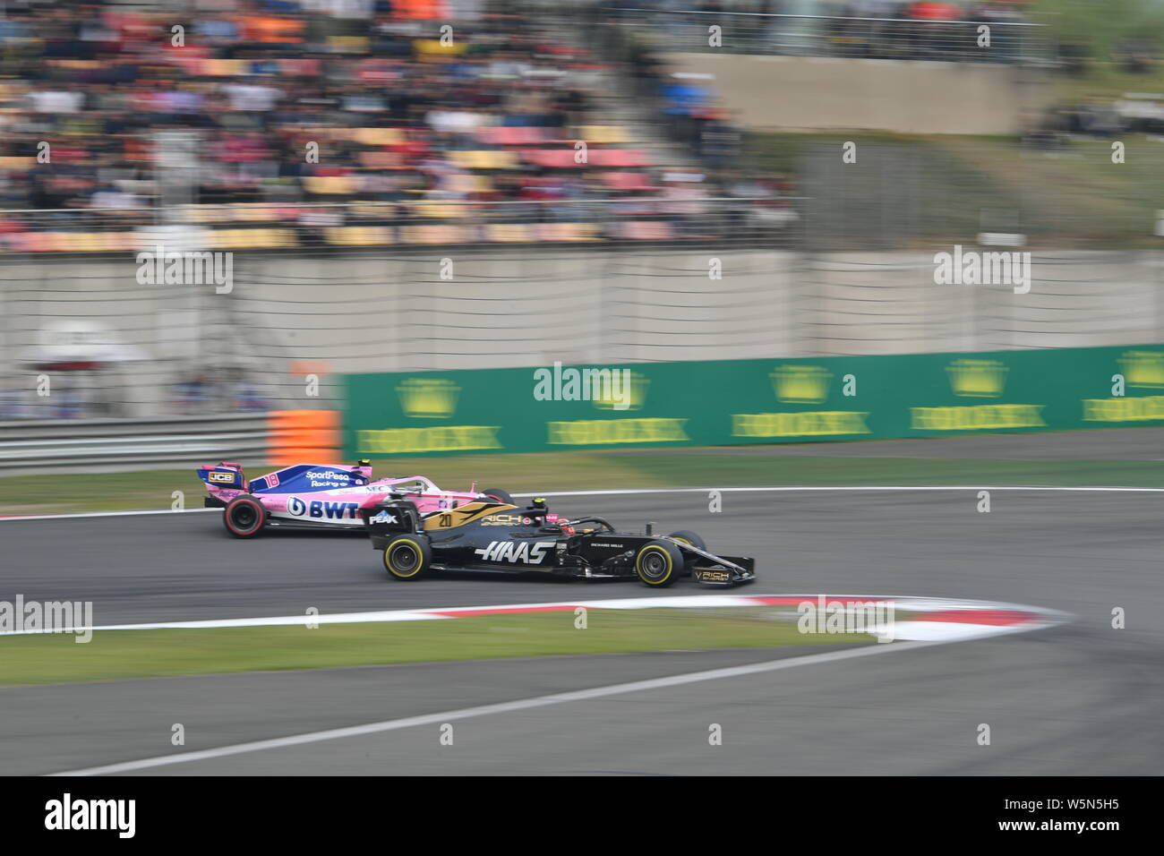 Danish Formula One driver Kevin Magnussen of Haas F1, front, and ...
