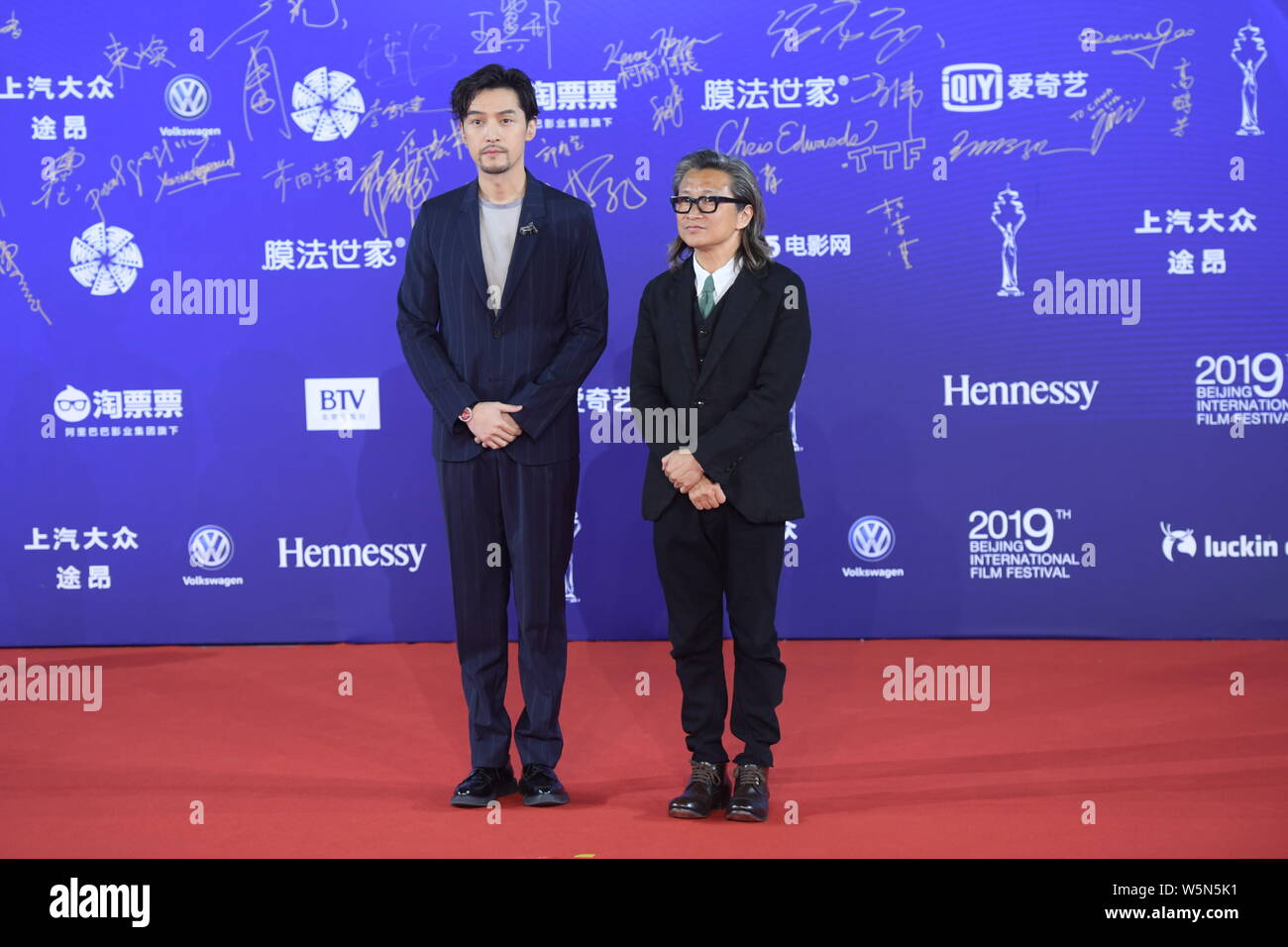Chinese actor Hu Ge, left, and Hong Kong director Peter Chan pose as ...