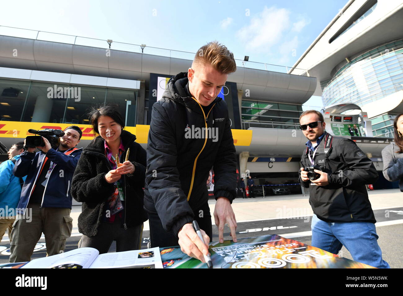 German racing driver Nico Hulkenberg of Renault F1 Team signs ...
