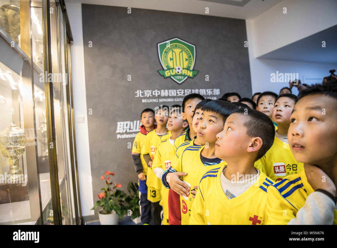 Chinese teenager football players take part in the "CSL's First-name ...
