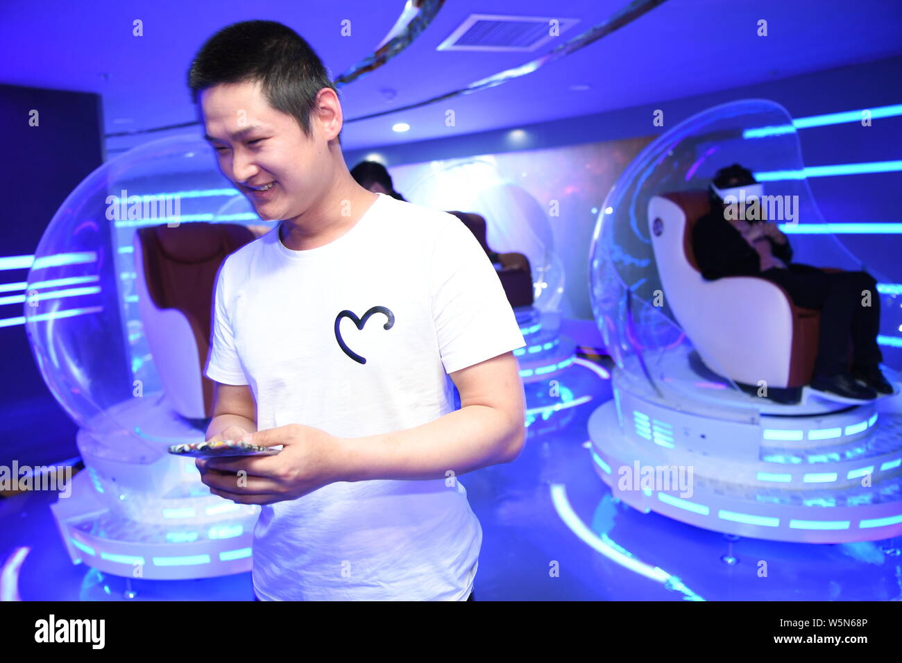 Chinese moviegoers visit the VR movie theater of Er Dong Pictures at ...