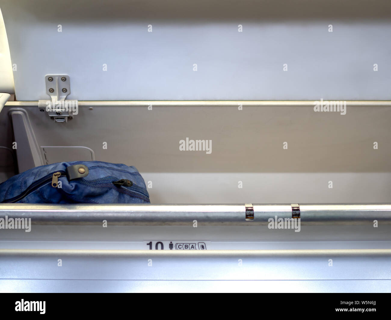 Overhead locker airplane hi-res stock photography and images - Alamy