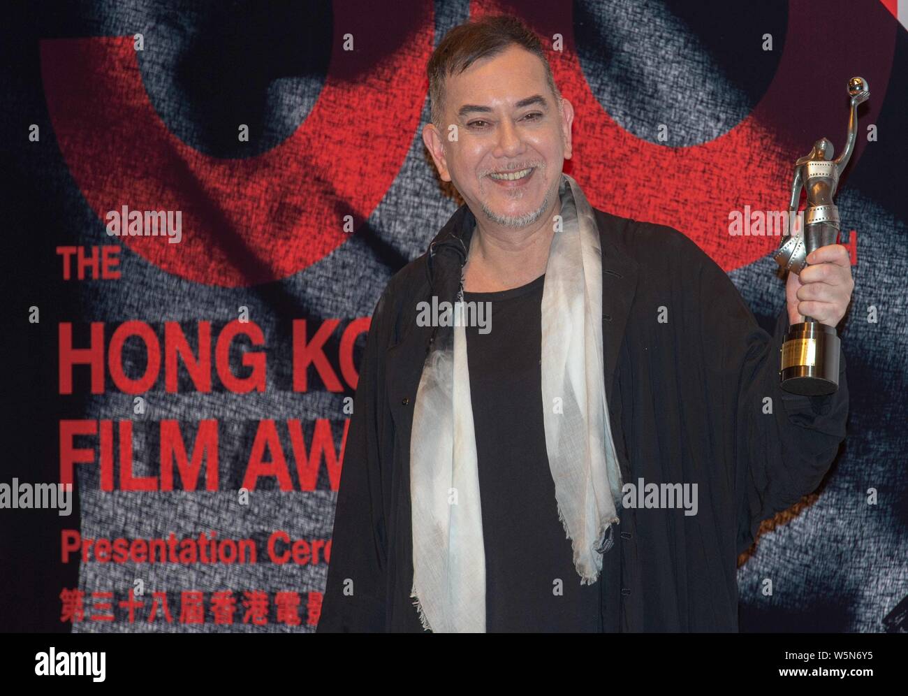 Hong Kong actor Anthony Wong poses with his trophy after winning "Best ...