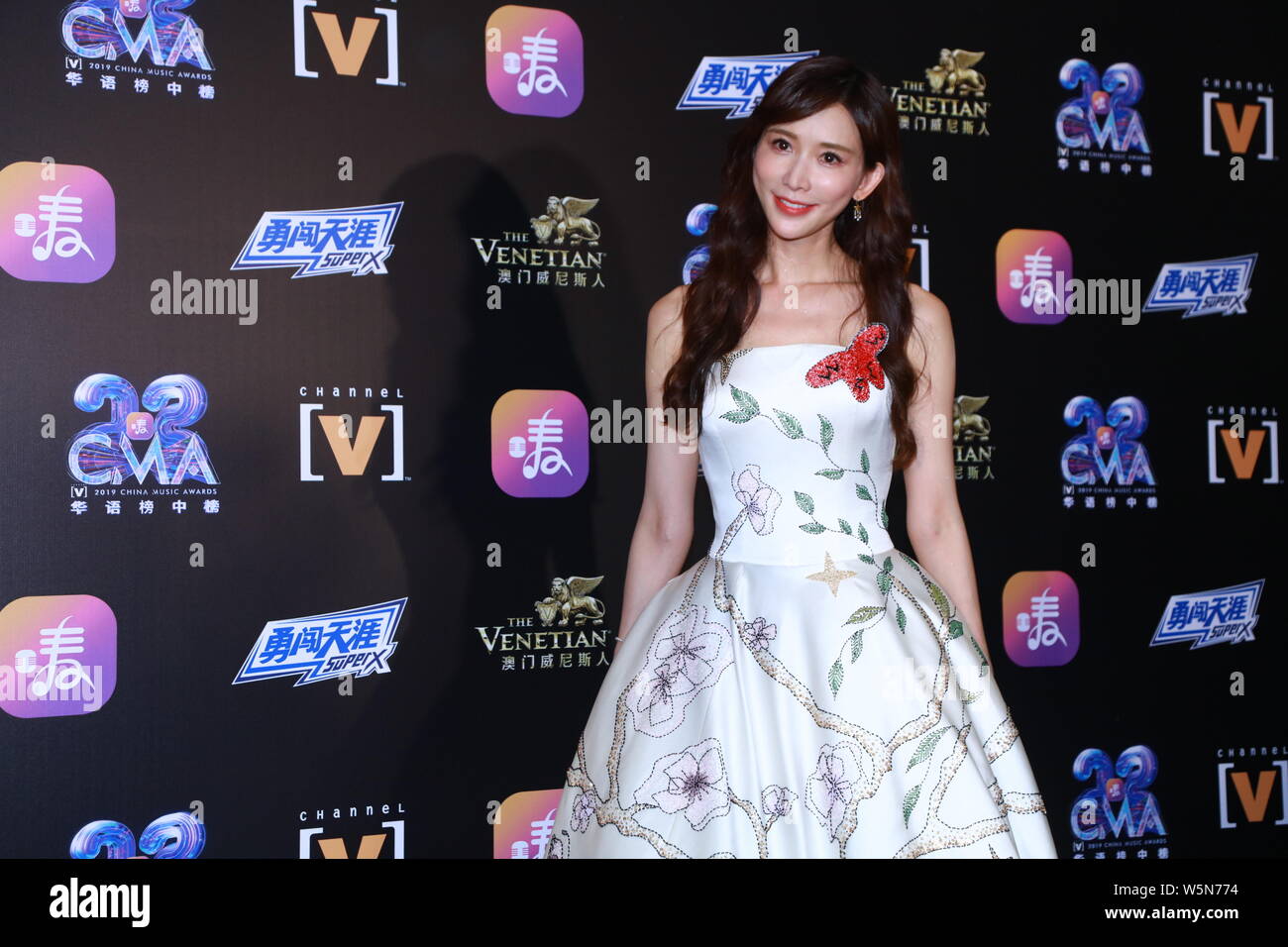 Taiwanese actress Lin Chi-ling poses with her trophies at the 23rd ...