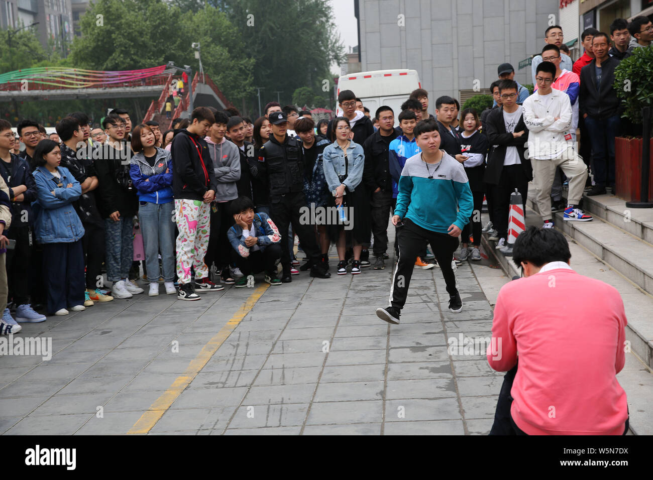 Chinese young buyers queue up in front of a sportswear store of Nike to ...