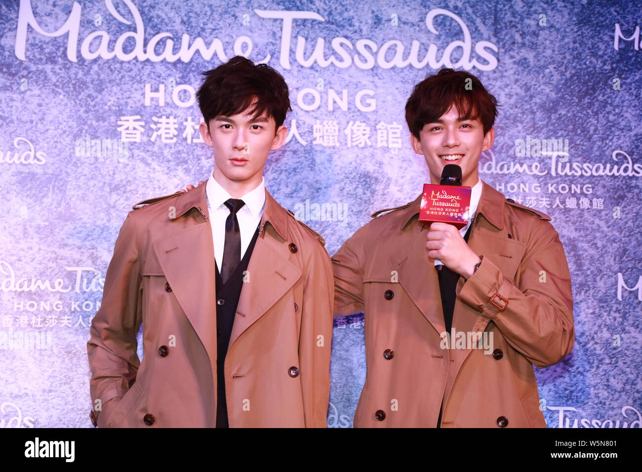 Chinese actor Leo Wu Lei, known as the "Nation's Little Brother" in China, right, poses with a ...