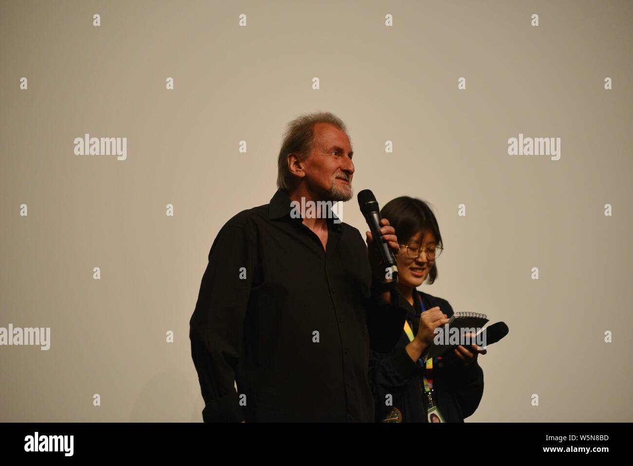 Austrian composer and piano player Gerhard Gruber interacts with ...