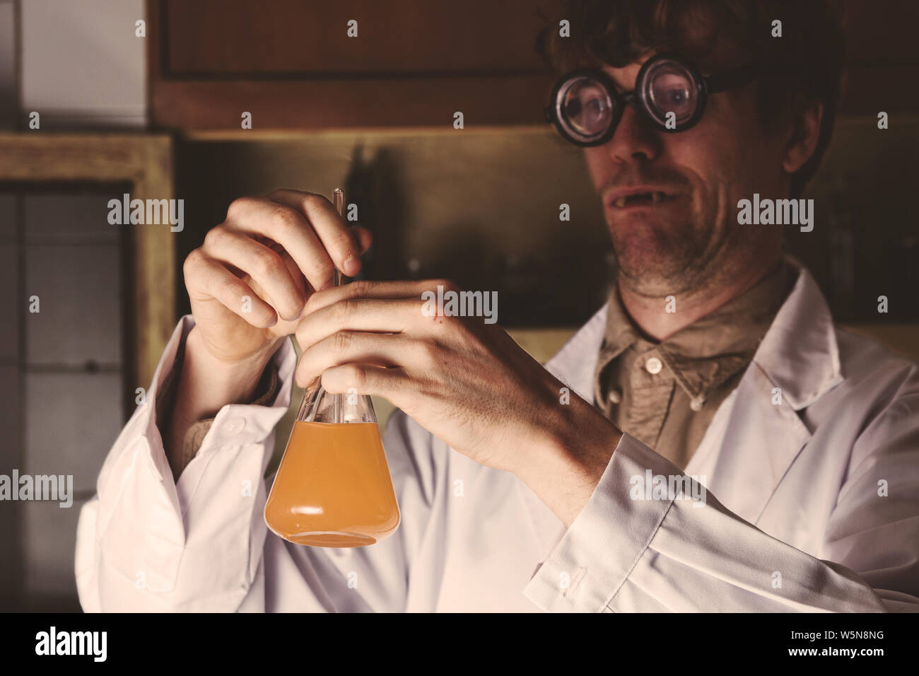 Crazy scientist in his lab doing experiments Stock Photo - Alamy