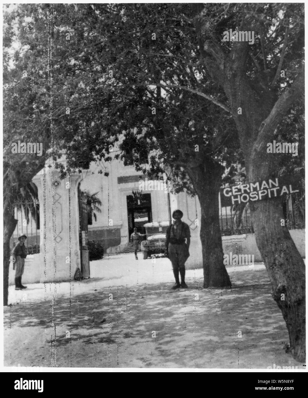 French soldiers stand guard at the entrance to the hospital for German ...