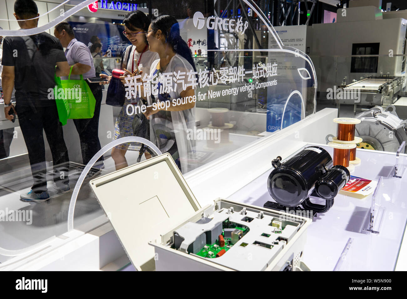 --FILE--People visit the stand of Gree during an expo in Shanghai ...