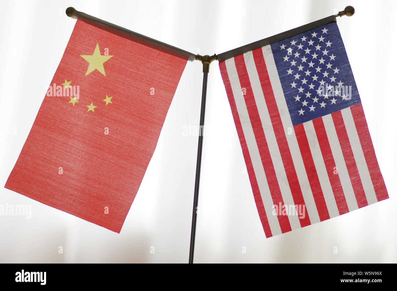 --FILE--National flags of China and the United States are seen in Ji ...
