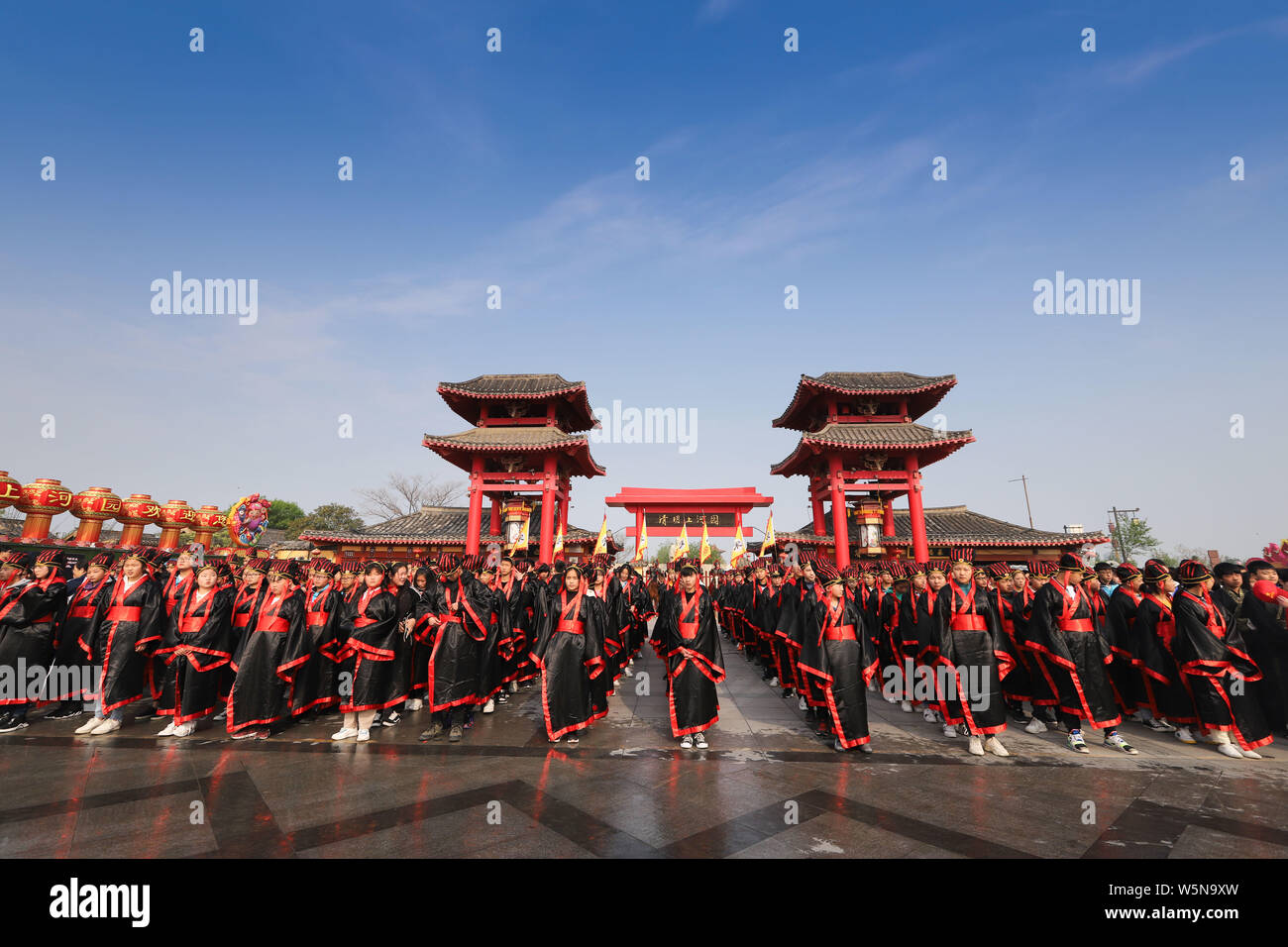 Students dressed in ancient Chinese costumes attend a traditional ...