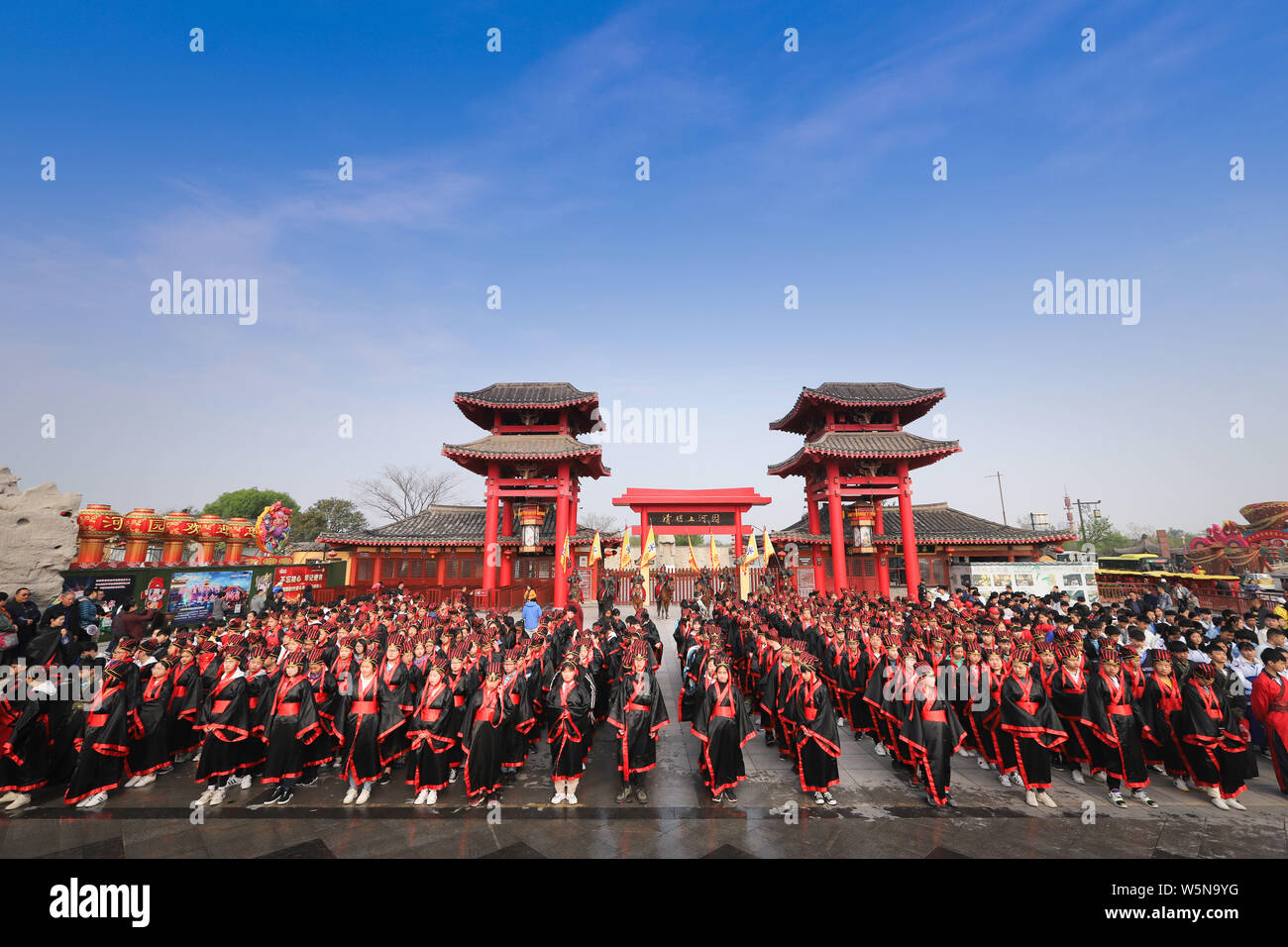 Students dressed in ancient Chinese costumes attend a traditional ...