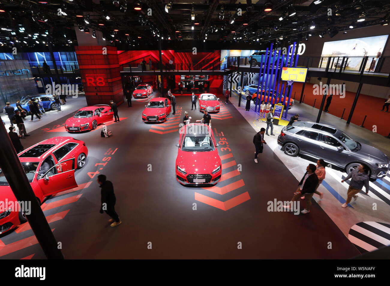People visit the stand of Audi during the 18th Shanghai International ...