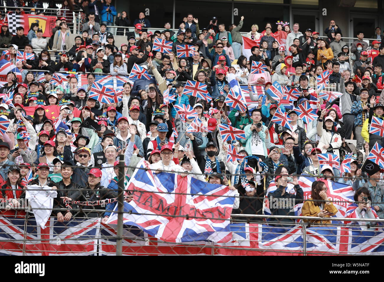 Fans cheer for British Formula One driver Lewis Hamilton of Mercedes ...