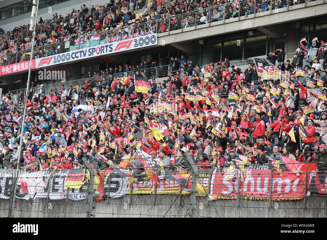 Fans cheer for German Formula One driver Sebastian Vettel of Ferrari ...