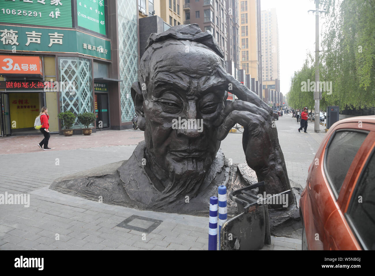 A half-buried sculpture of Sima Qia, Chinese historian of the early Han ...