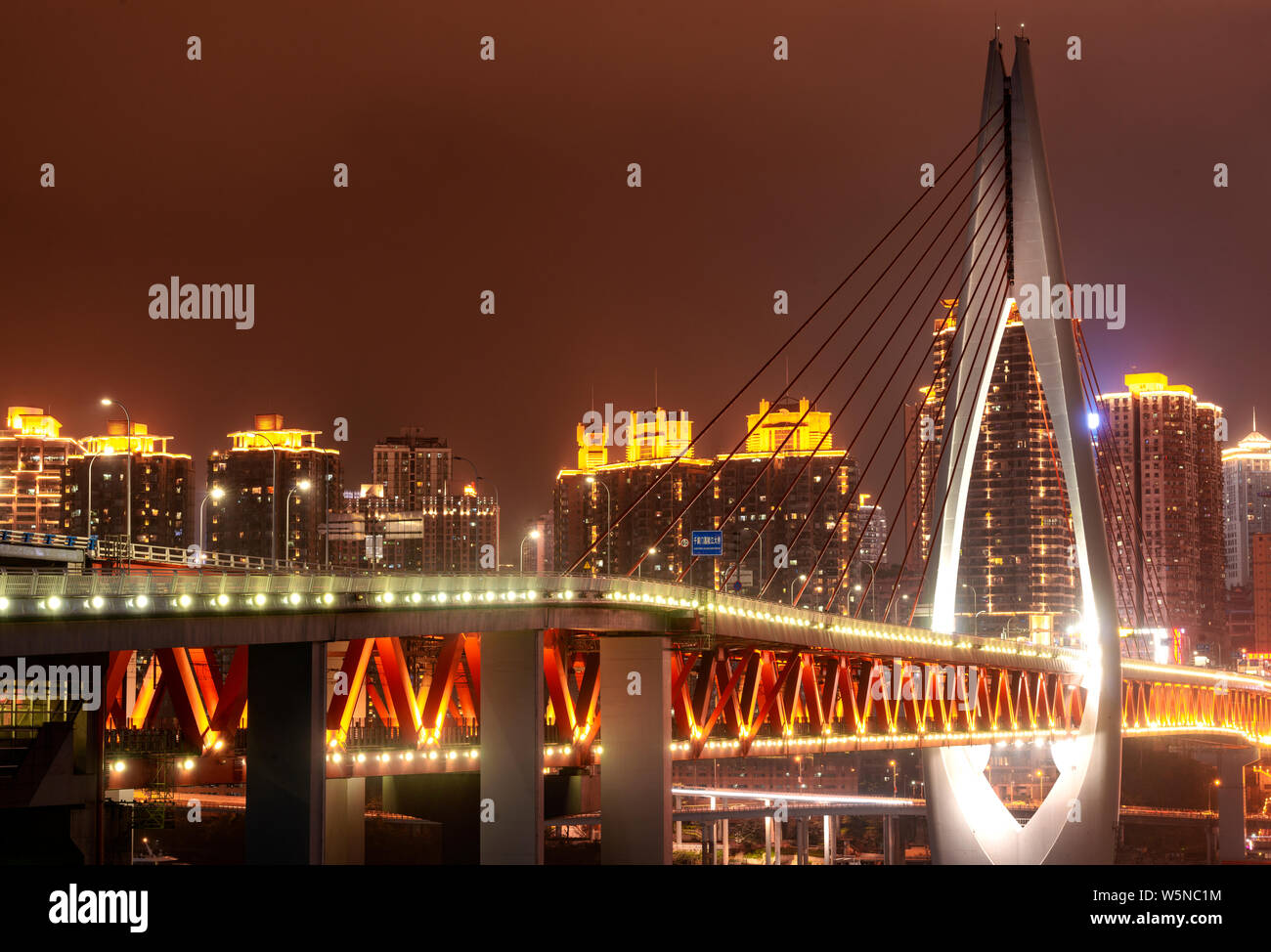 --FILE--Night view of the Qiansimen Jialing River Bridge leading to ...
