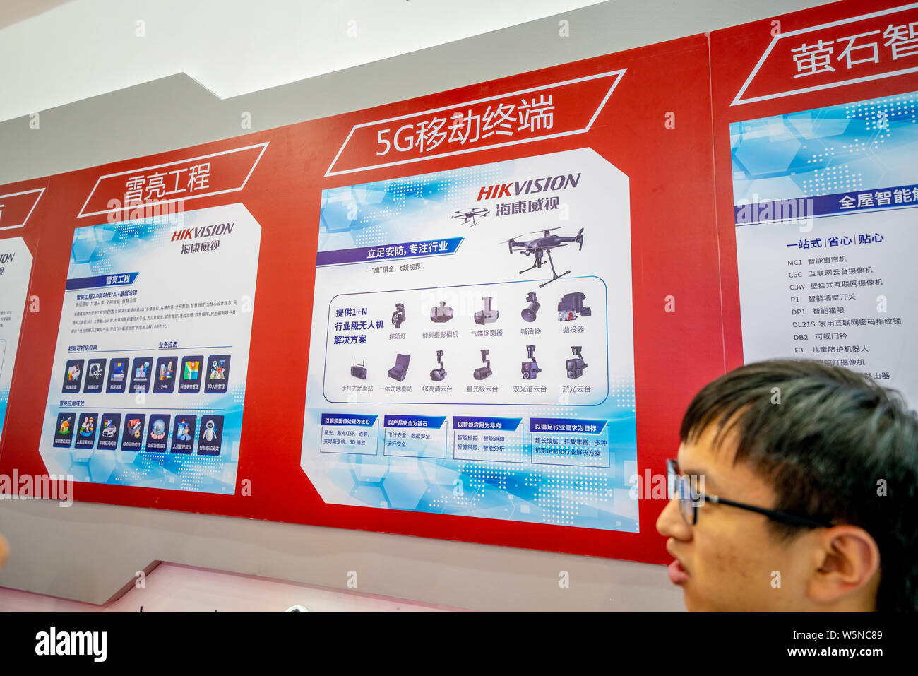 --FILE--People visit the stand of Shenzhen-listed security camera ...