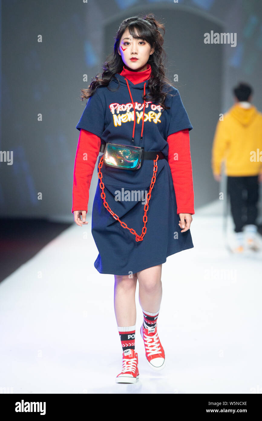 Singer Li Yitong of Chinese idol group SNH48 displays a new creation at ...