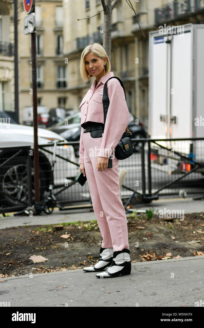 A trendy woman poses for street snaps during the Paris Fashion Week ...