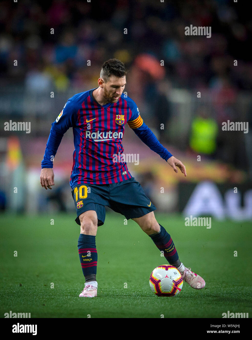 Lionel Messi of FC Barcelona dribbles during their 33rd round match of ...