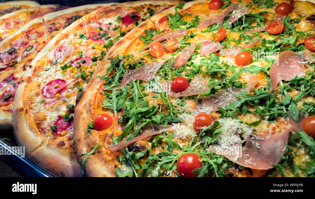 Pizza on a shop window, close-up Stock Photo - Alamy
