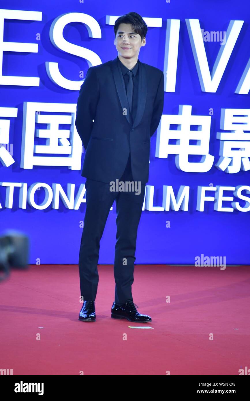 Chinese actor Li Yifeng arrives on the red carpet for the closing and ...