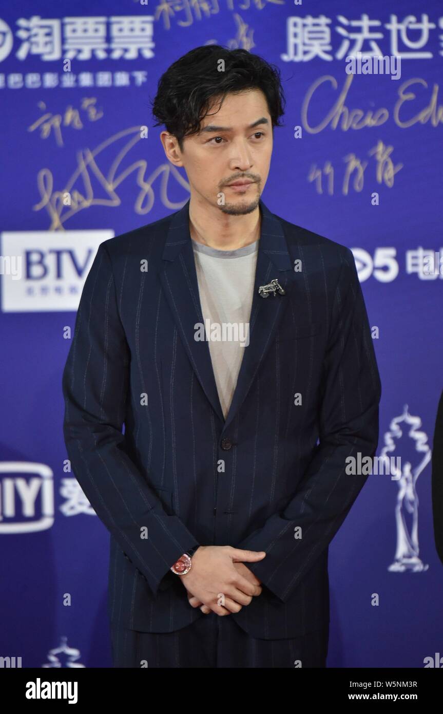 Chinese actor Hu Ge poses as he arrives on the red carpet for the ...