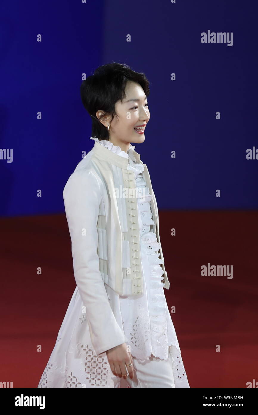 Chinese actress Zhou Dongyu poses as she arrives on the red carpet for ...