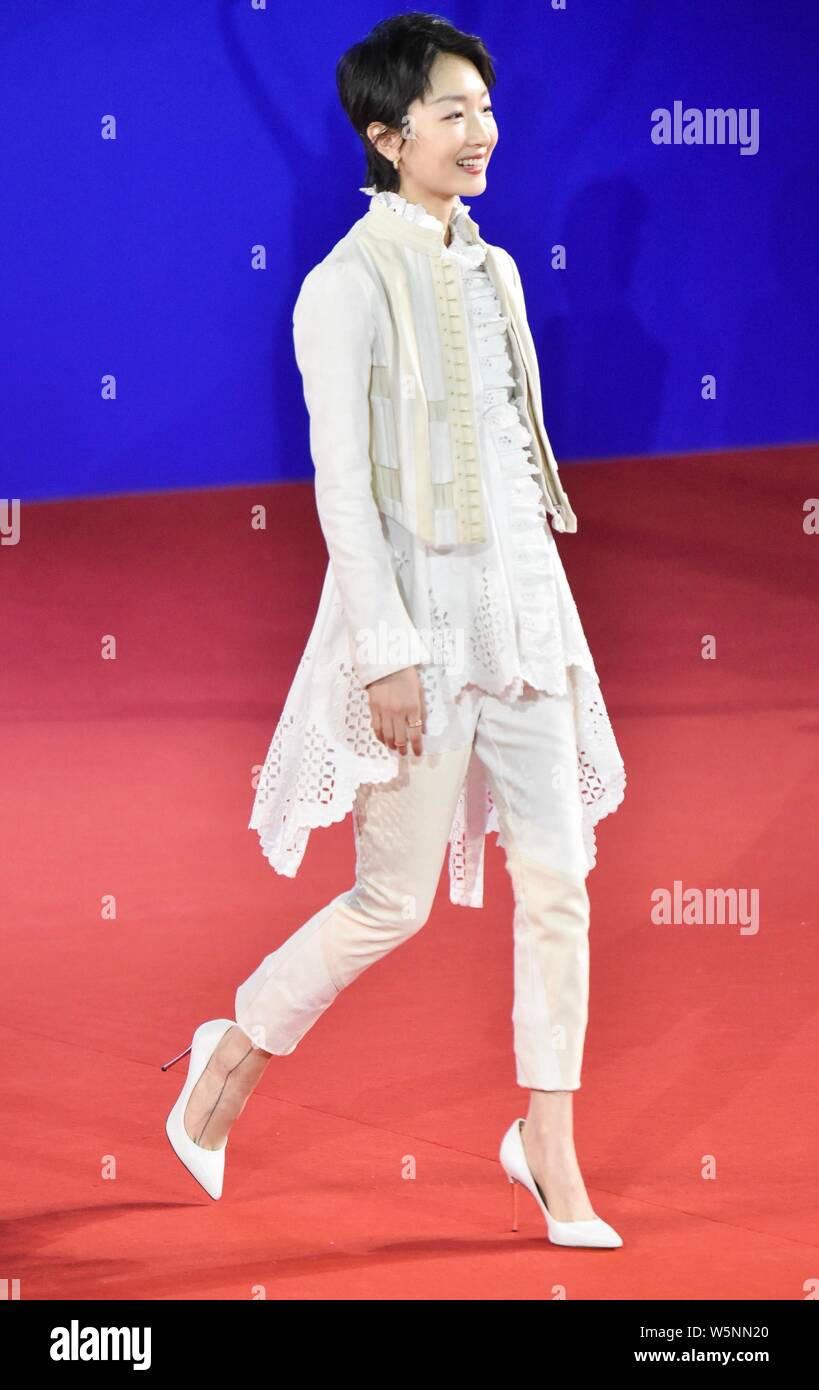 Chinese actress Zhou Dongyu poses as she arrives on the red carpet for ...