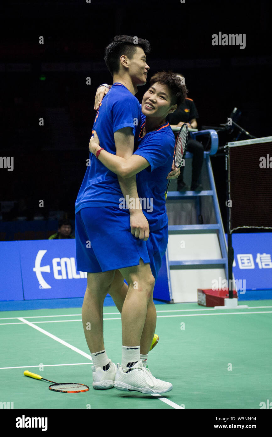 Wang Yilyu and Huang Dongping of China celebrate after defeating He ...