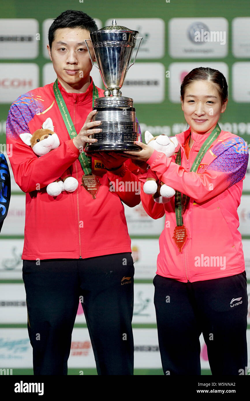 Xu Xin and Liu Shiwen of China poses with their trophy after defeating ...