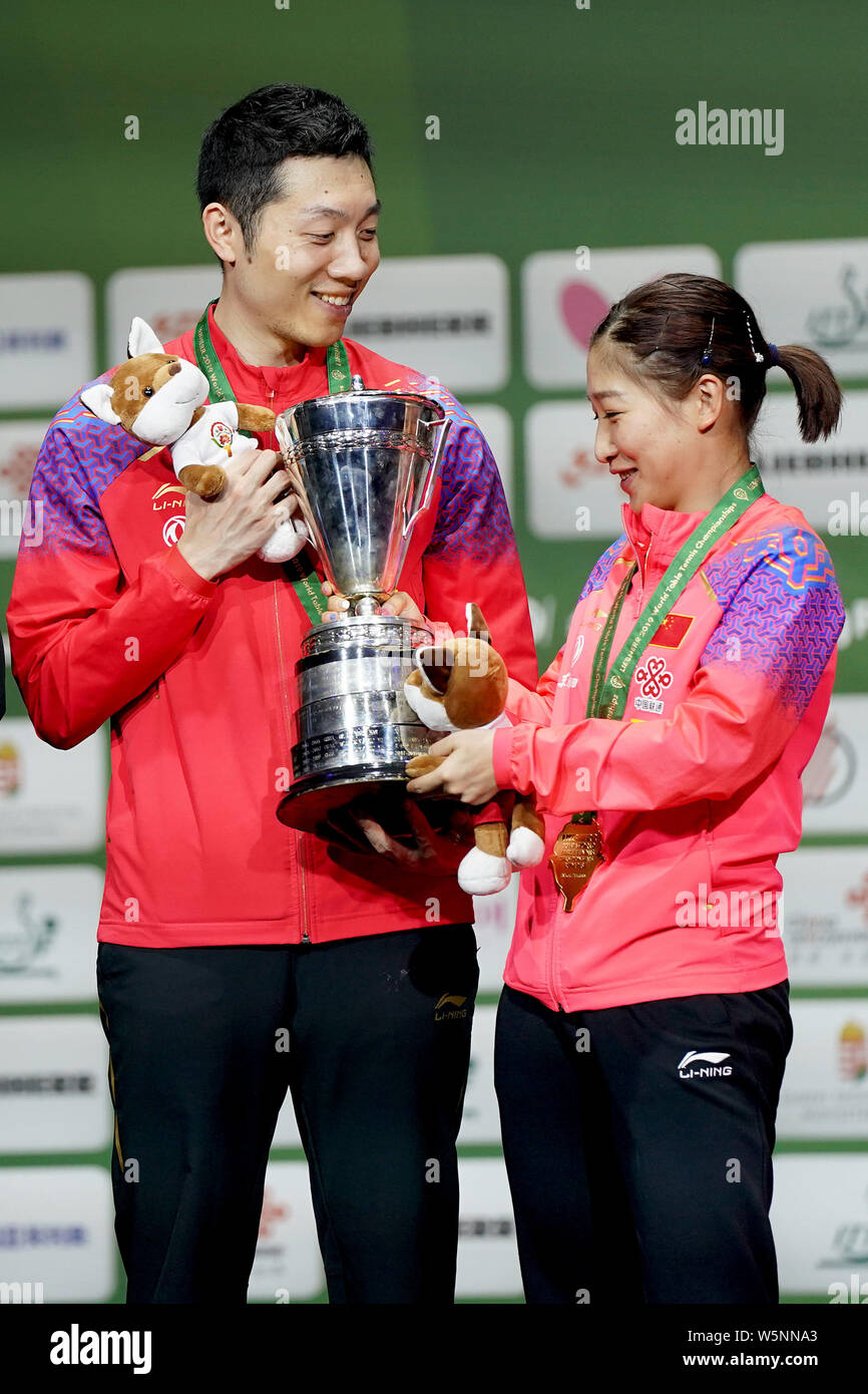Xu Xin and Liu Shiwen of China poses with their trophy after defeating ...