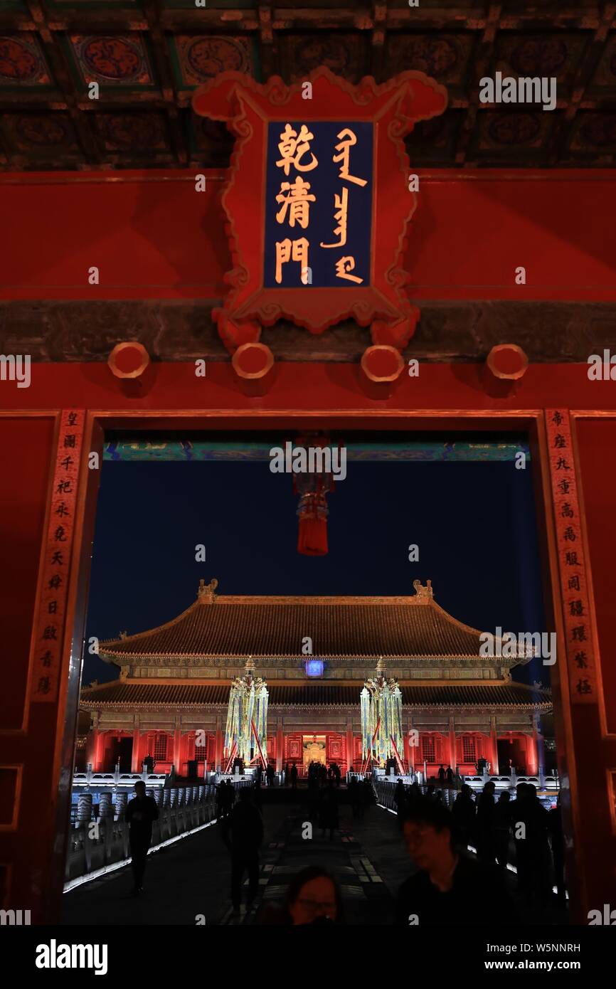 Shan Jixiang, left, the museum curator, issues the certificate for a ...