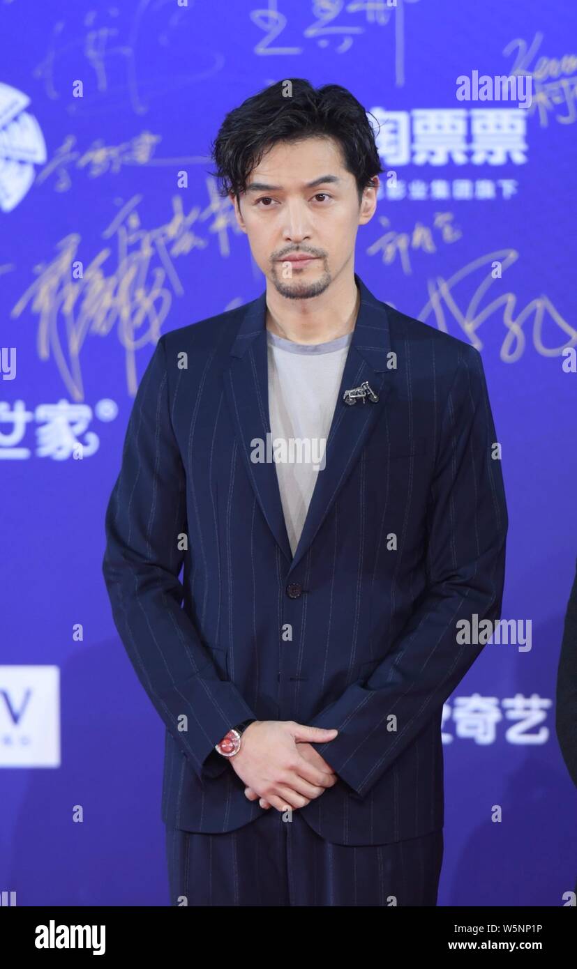 Chinese actor Hu Ge poses as he arrives on the red carpet for the ...