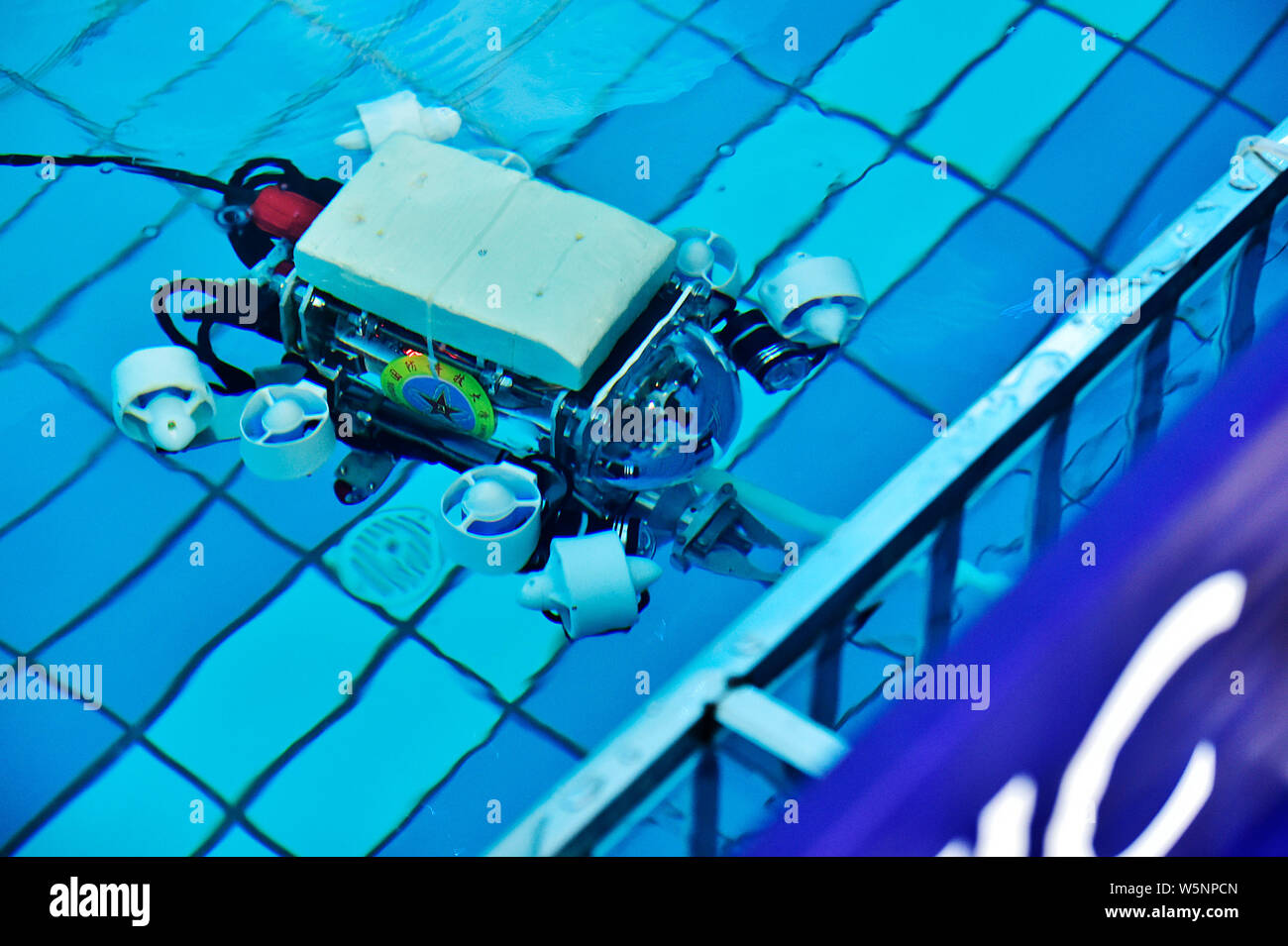 College students operate their underwater robots during the Underwater ...