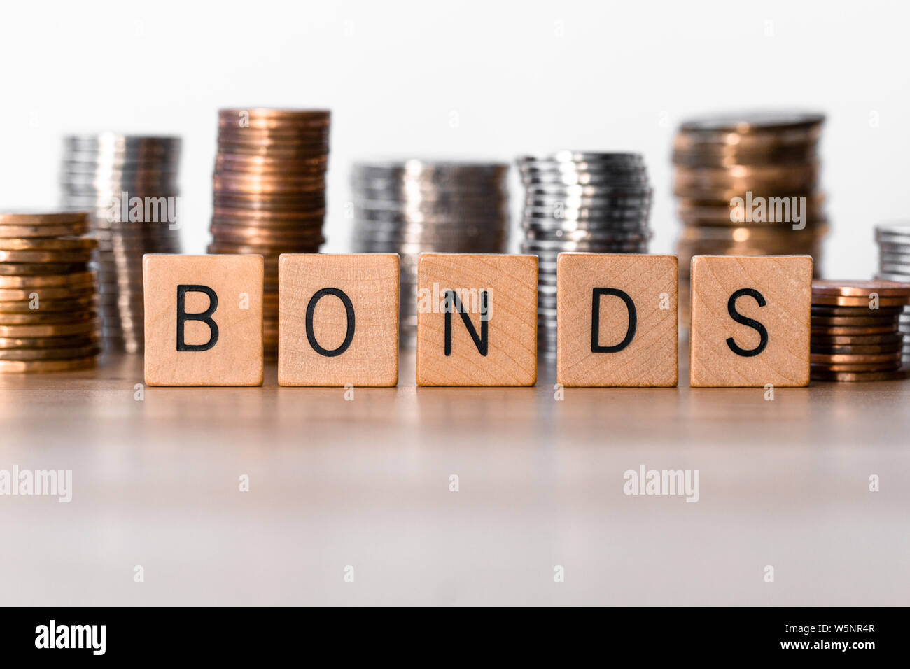 Bond sign with coins in the background Stock Photo - Alamy